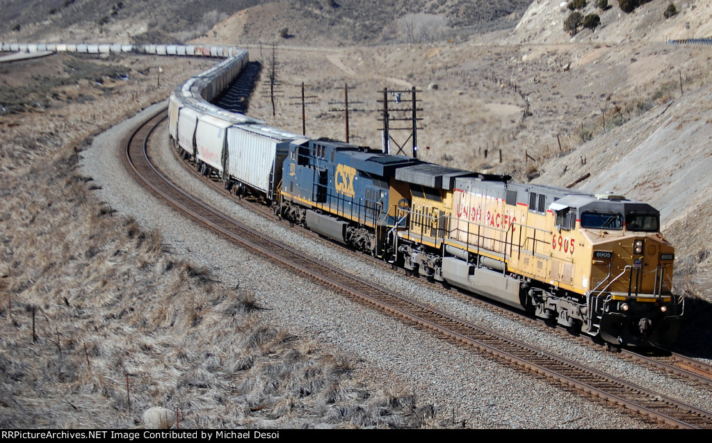 "Invader" UP C44/60AC # 6905 teams up with CSX ES-44AC #879, powering an eastbound UP grain ...